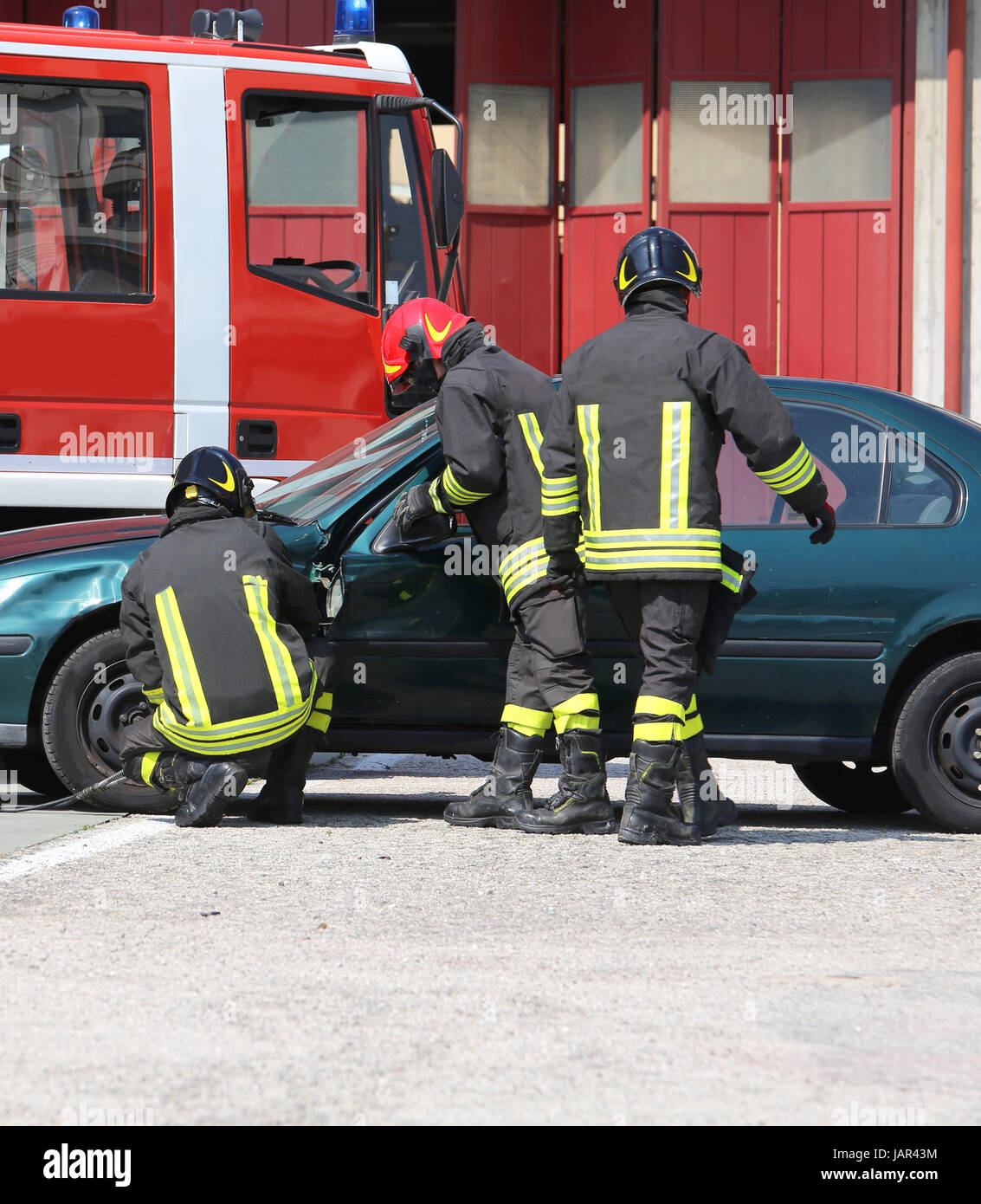 Firefighters during rescue after road accident Stock Photo - Alamy