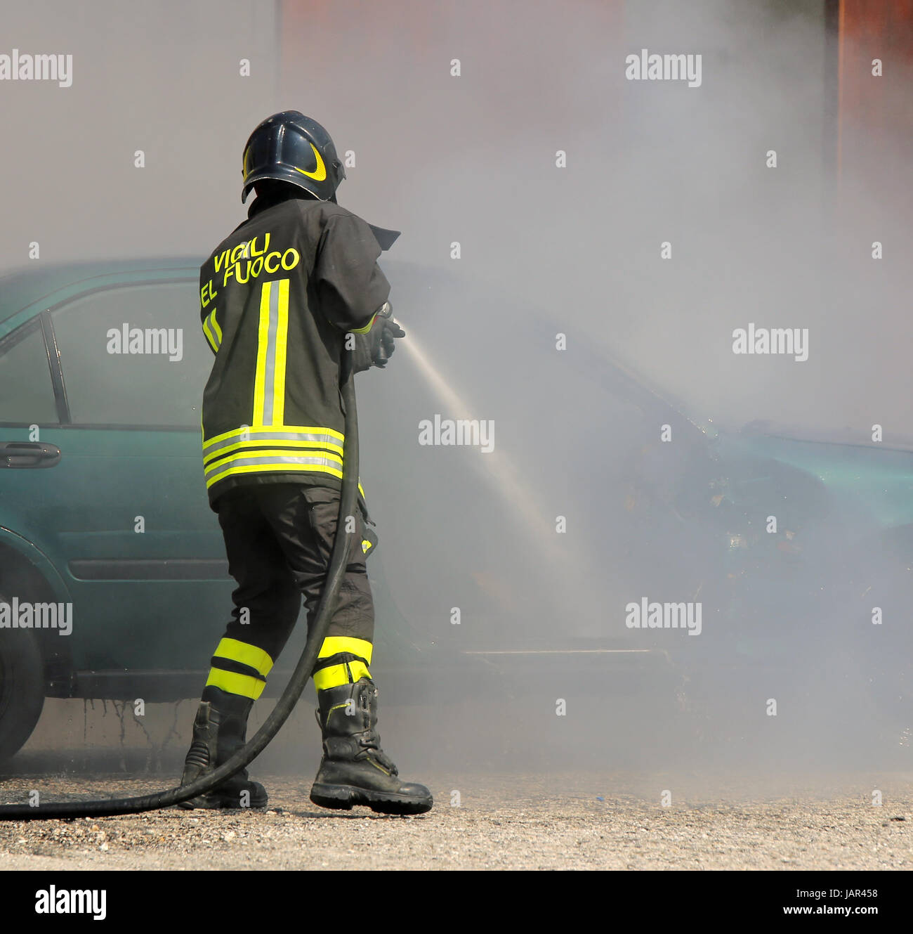 Italian fireman with the writen on the uniform meaning firemen turn off ...