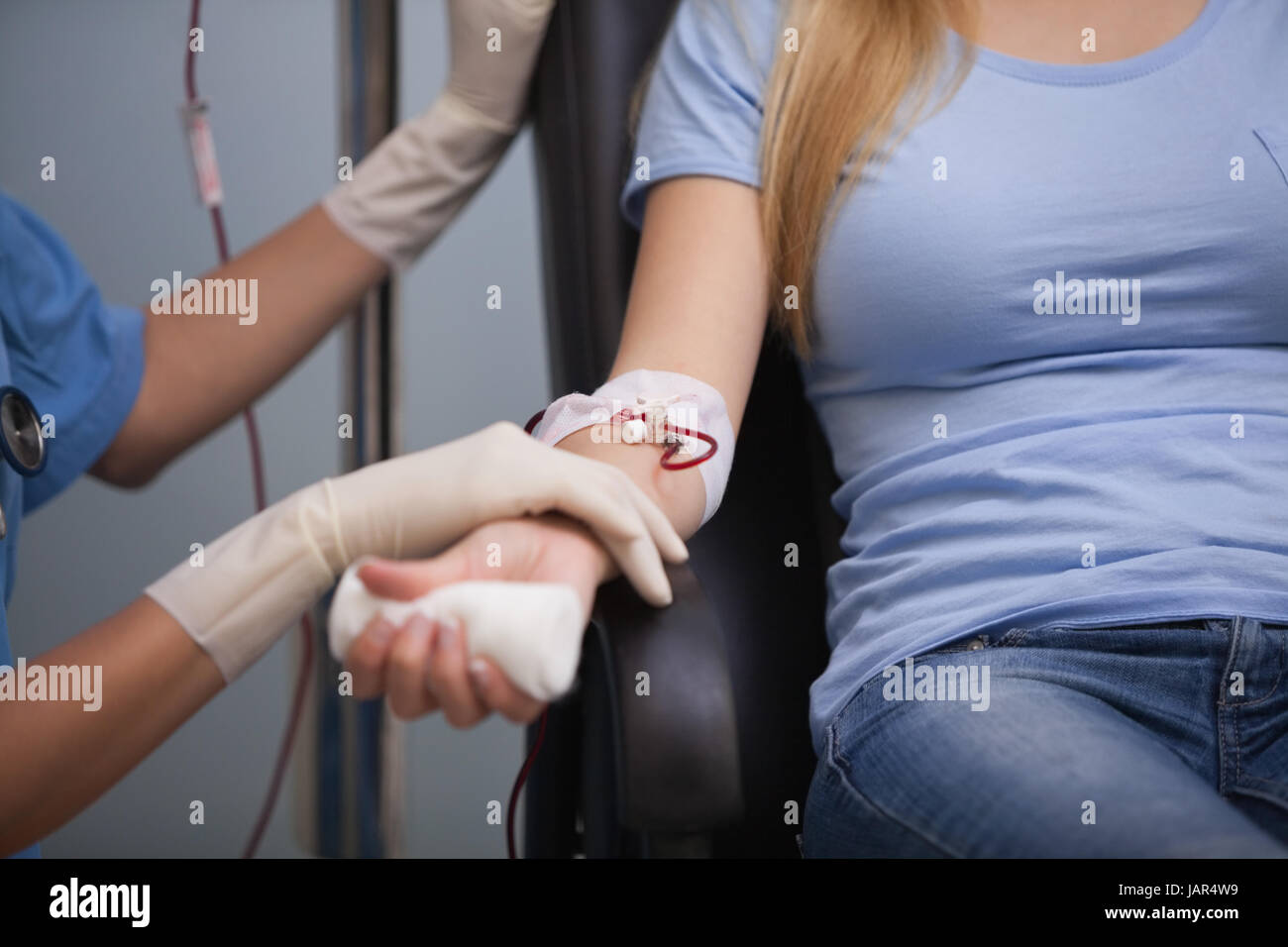 Female patient giving her blood in a hospital Stock Photo - Alamy