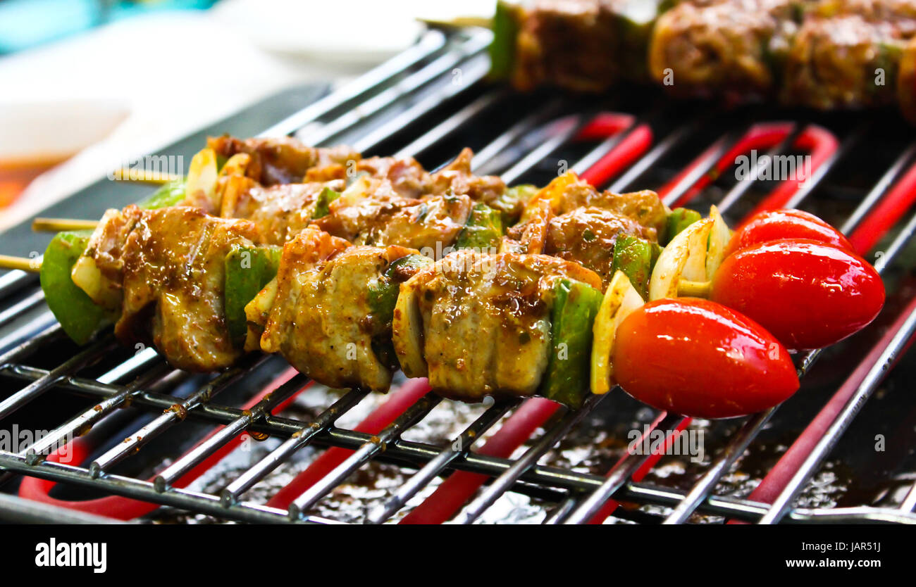 Sizzling barbecue sticks with meat and vegetables Stock Photo - Alamy