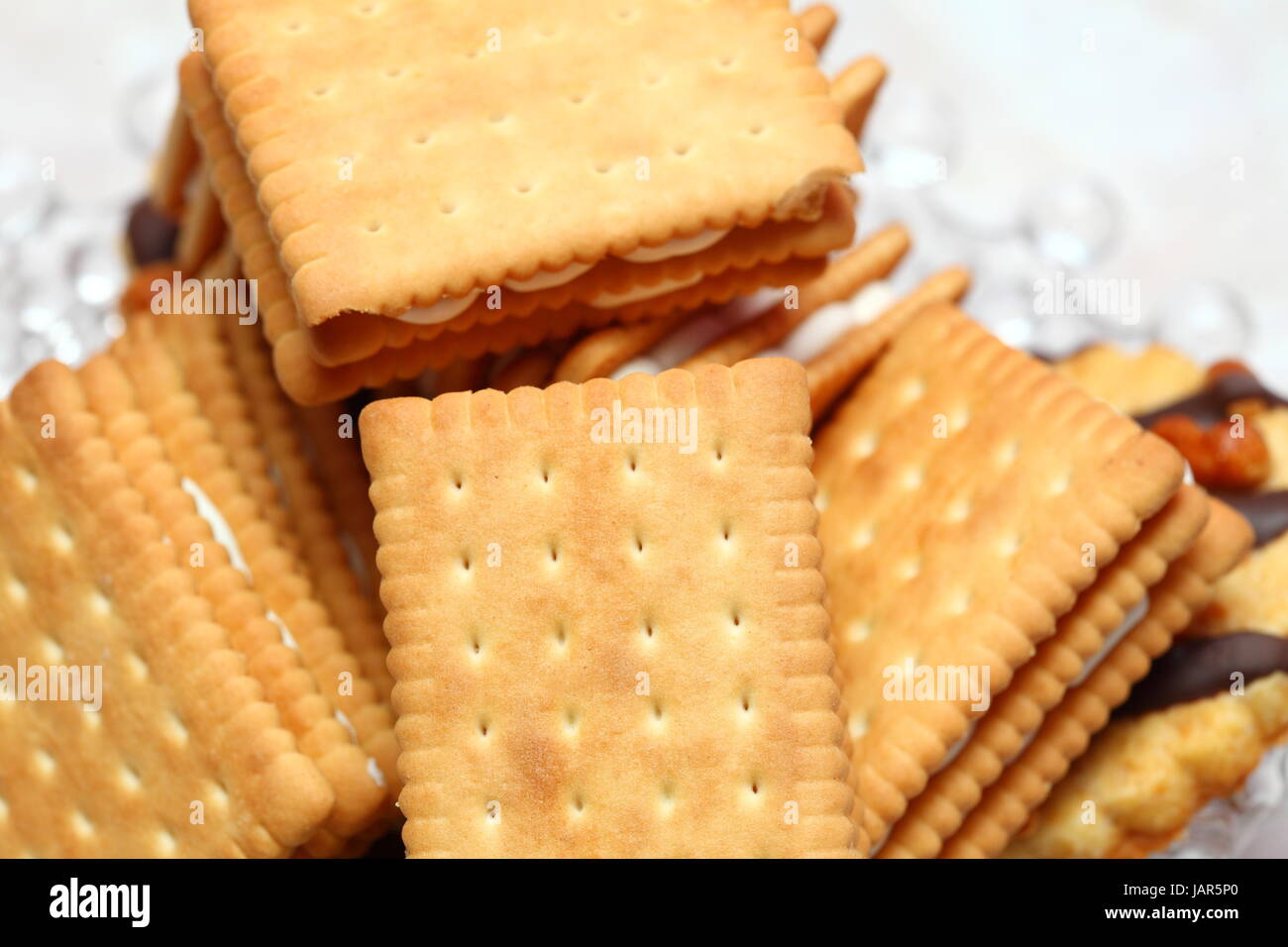 Closeup cookie biscuits with filling on white background Stock Photo ...
