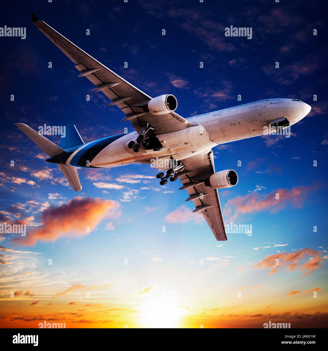Jet cruising at sunset Stock Photo - Alamy