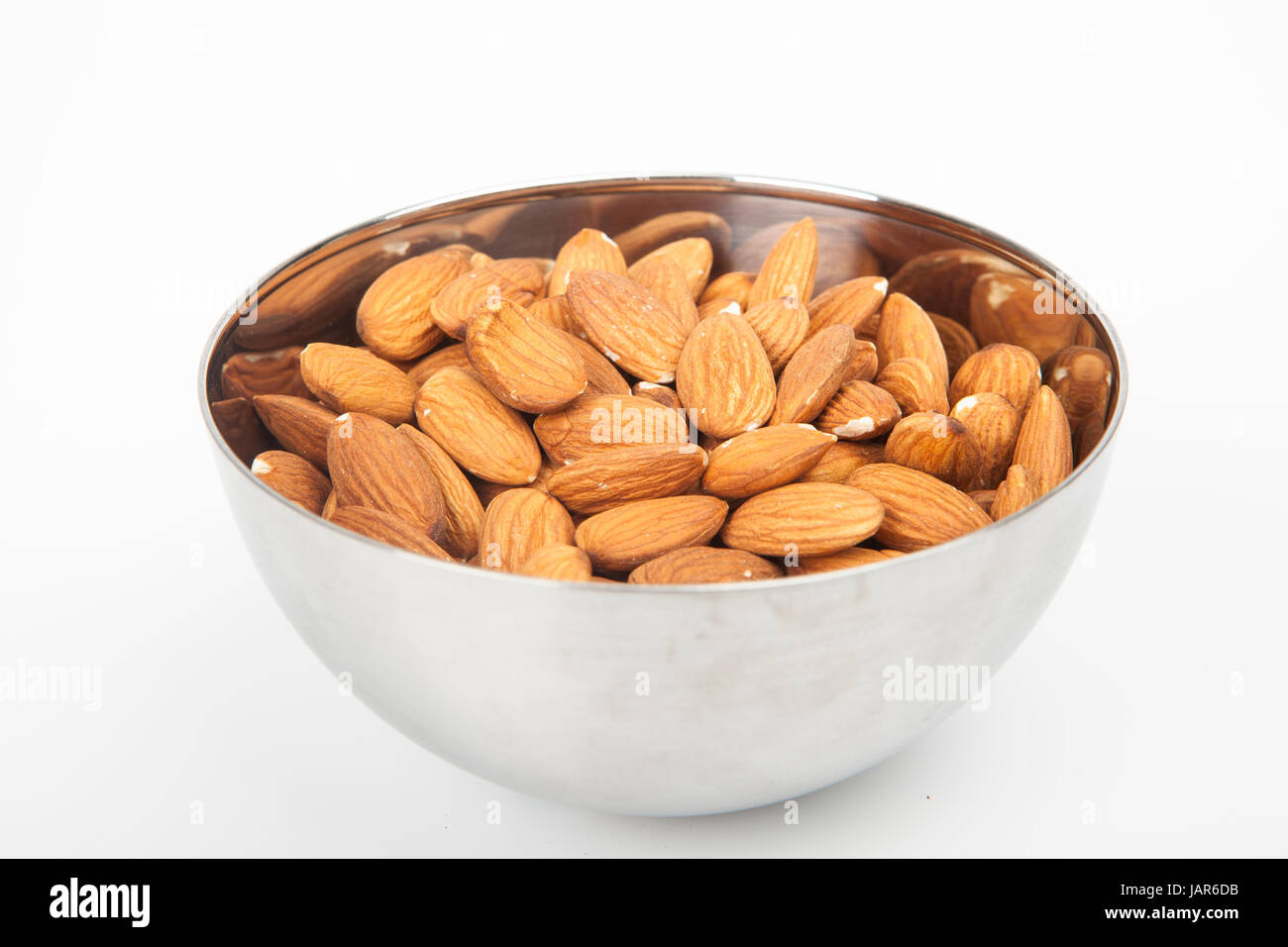Many almonds isolated on white background Stock Photo - Alamy