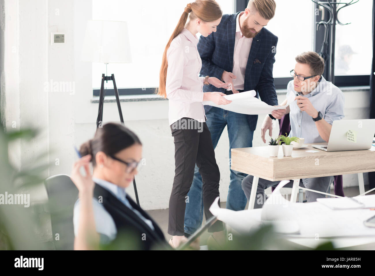 Young businesspeople working together Stock Photo - Alamy