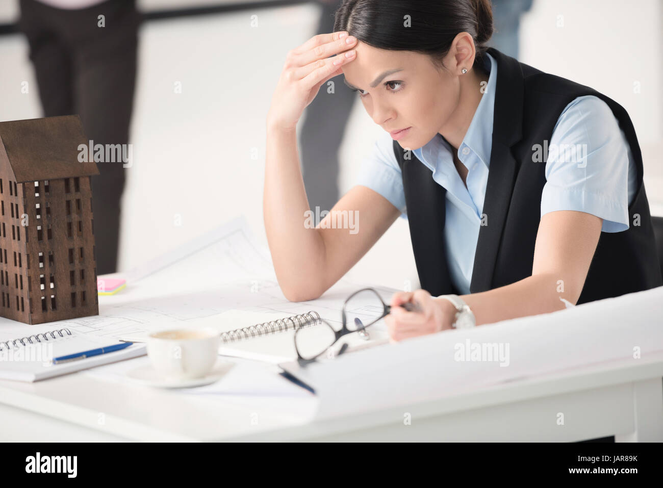 Tired young businesswoman Stock Photo - Alamy