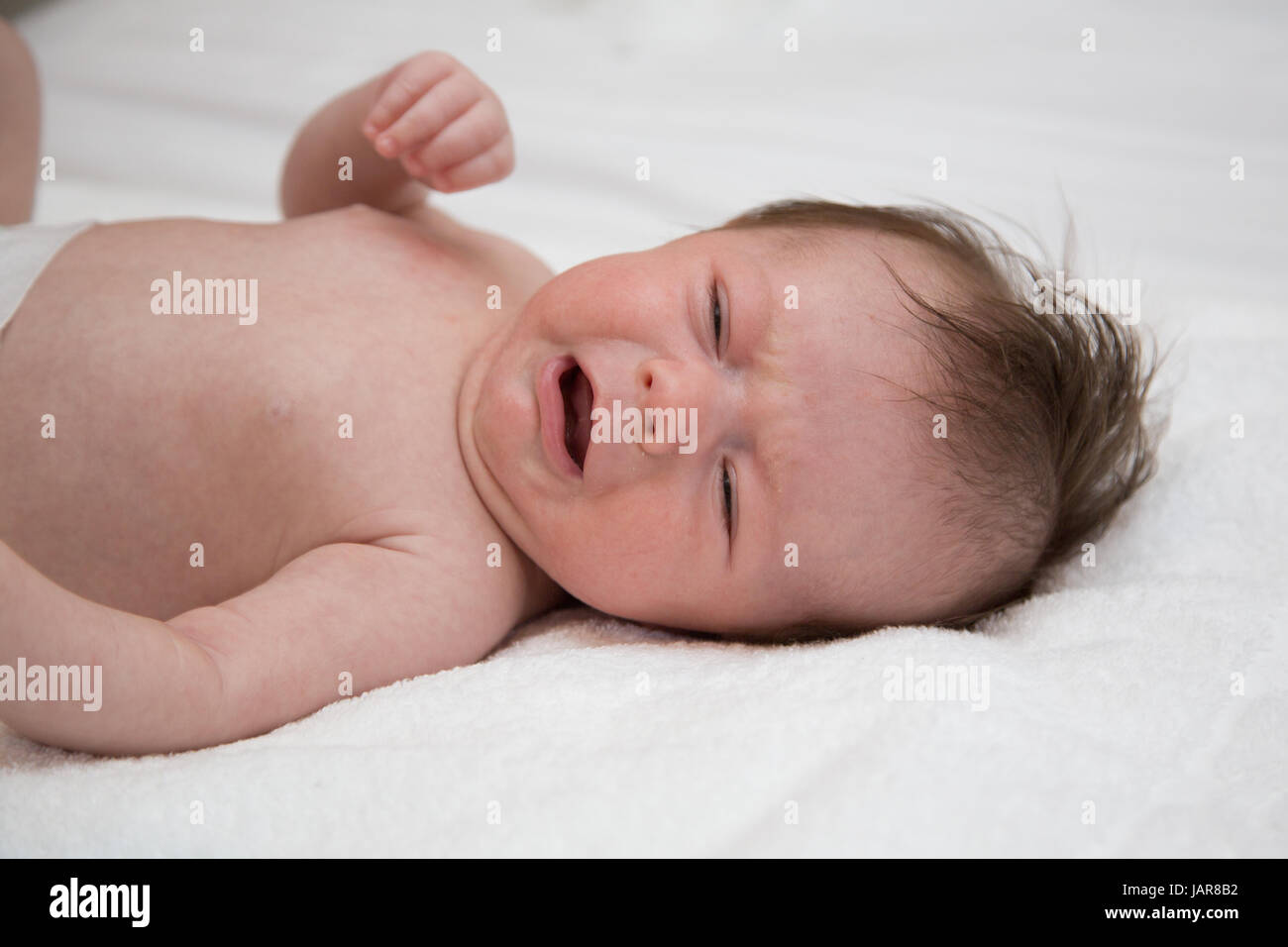 Crying newborn baby Stock Photo - Alamy