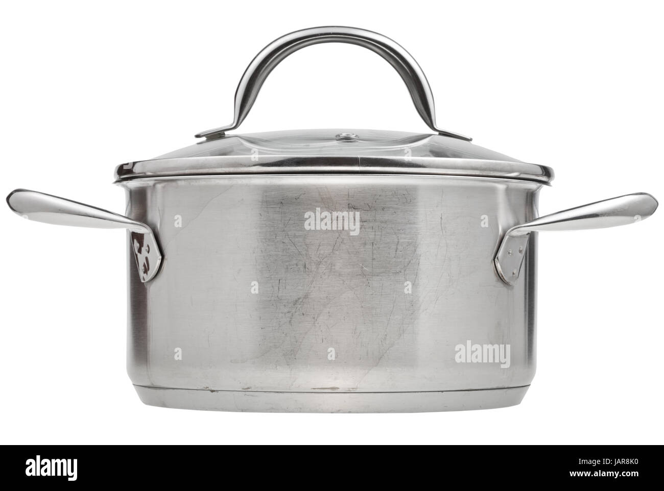 side view of small stainless steel saucepan covered by glass lid ...