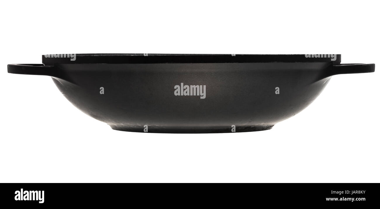 side view of open flatter-bottomed wok pan isolated on white background ...