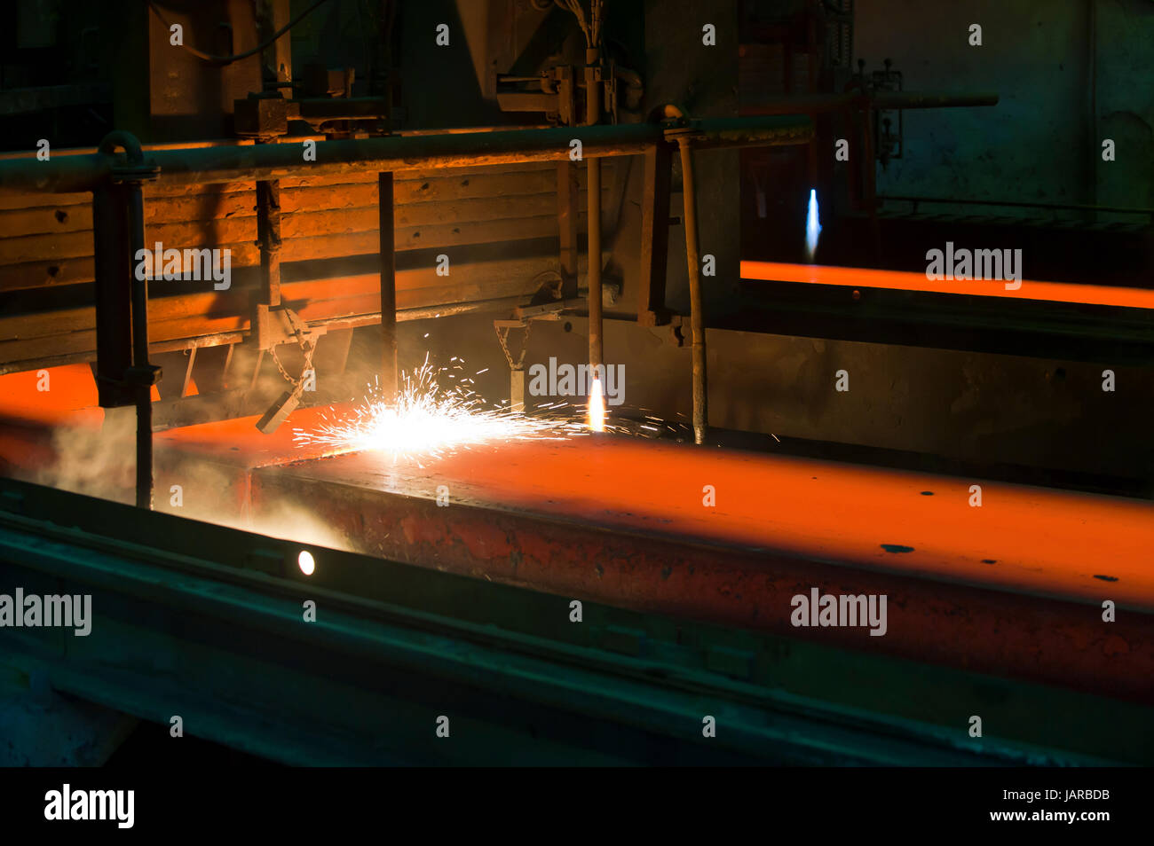 Gas cutting of the hot metal inside of plant Stock Photo - Alamy
