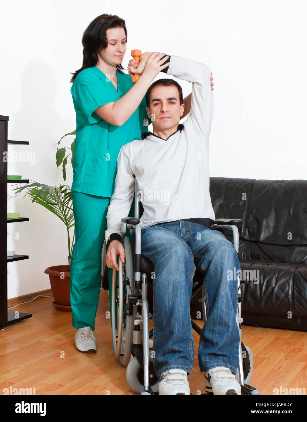 Young Man Working With a Physical Therapist Stock Photo - Alamy