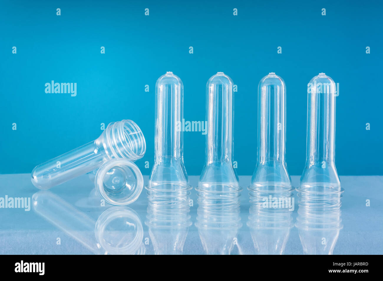 Clear PET Preforms on sky blue background for presentation Stock Photo ...