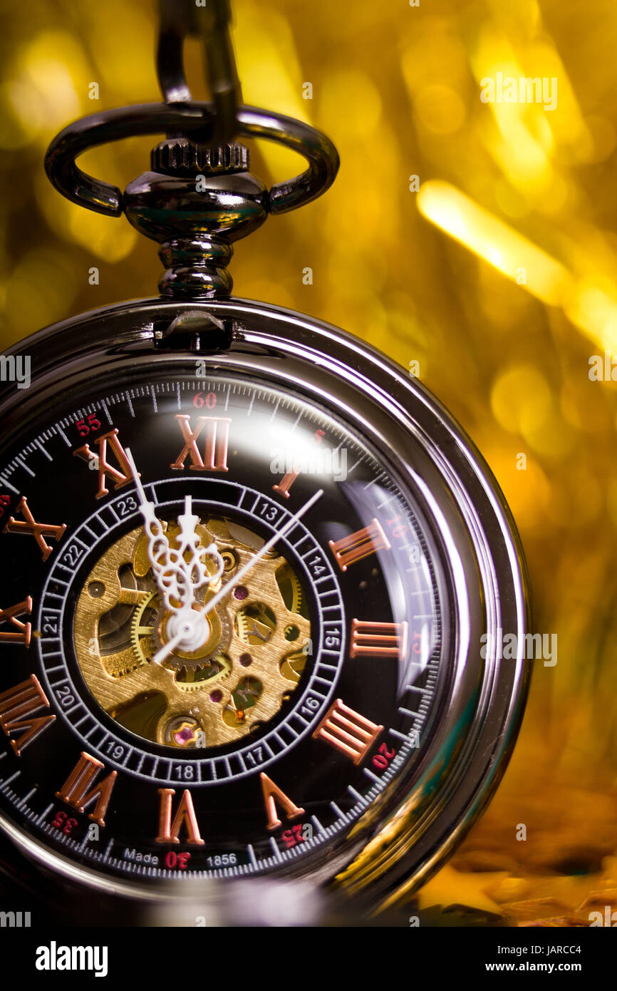 beautiful pocket watch arrows indicate midnight. macro Stock Photo - Alamy