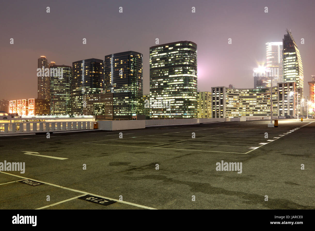Empty parking lot in the city at night Stock Photo - Alamy
