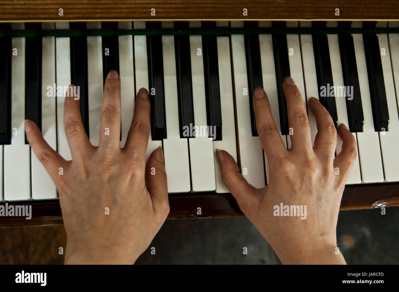 Woman hands playing piano hi-res stock photography and images - Alamy