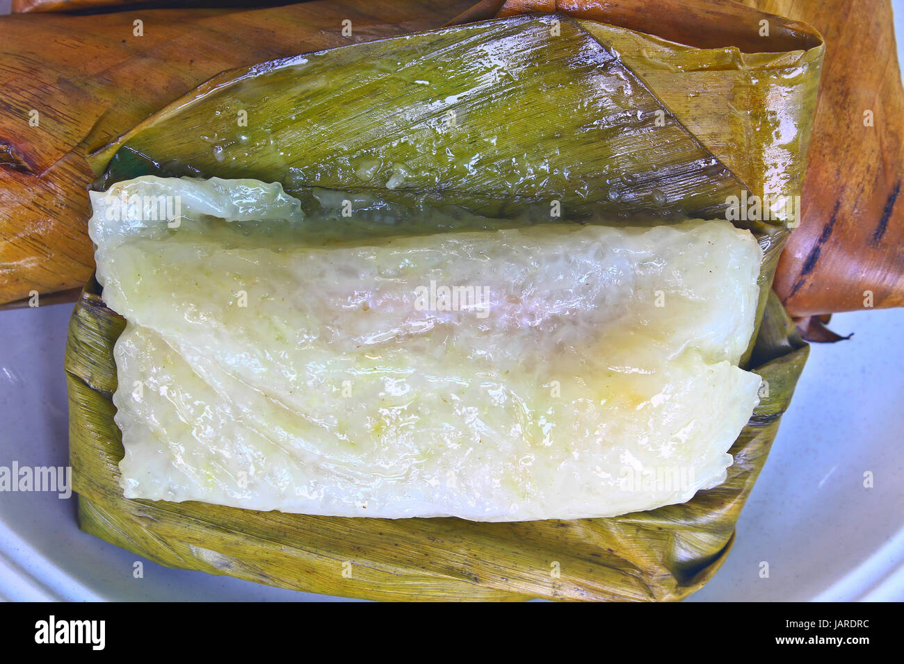 Thai style dessert, made from banana and glutinous rice, wrap with ...