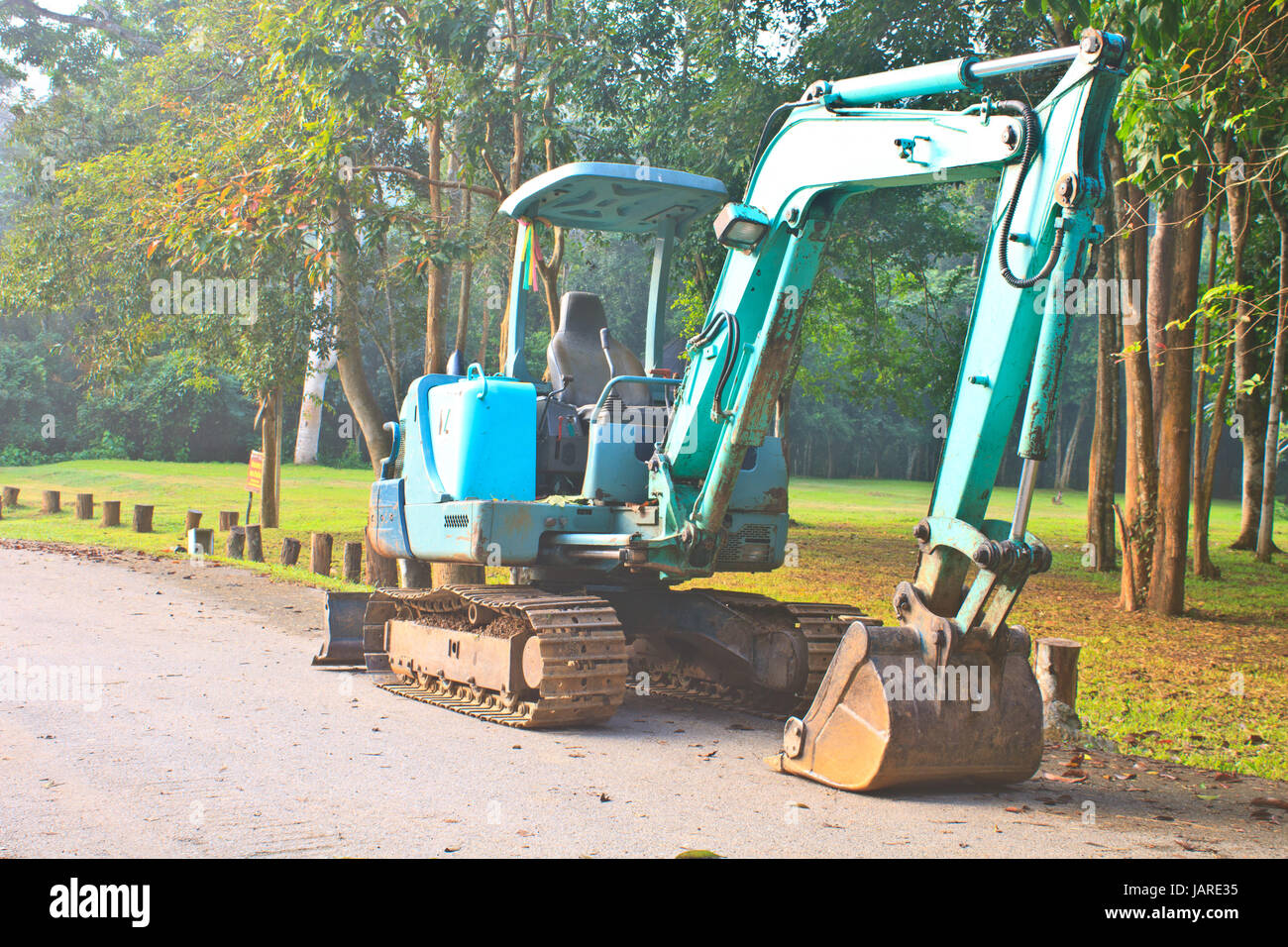 Back Hoe construction machinery equipment standing in construction site ...
