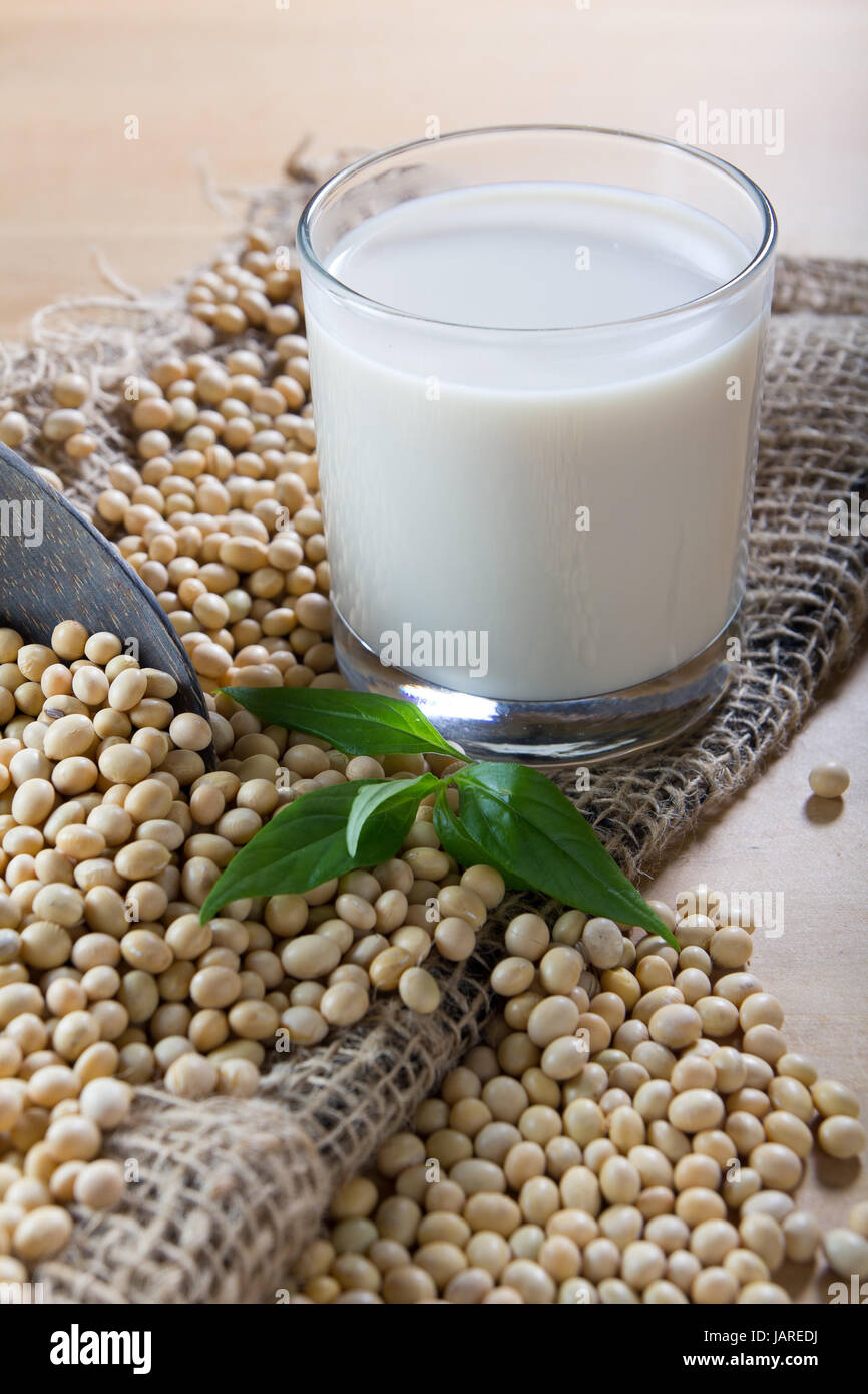 soy milk with soy beans background Stock Photo - Alamy