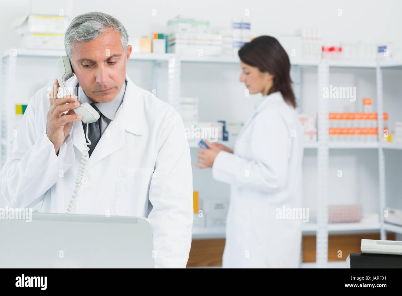 Mature woman telephone ill hi-res stock photography and images - Alamy