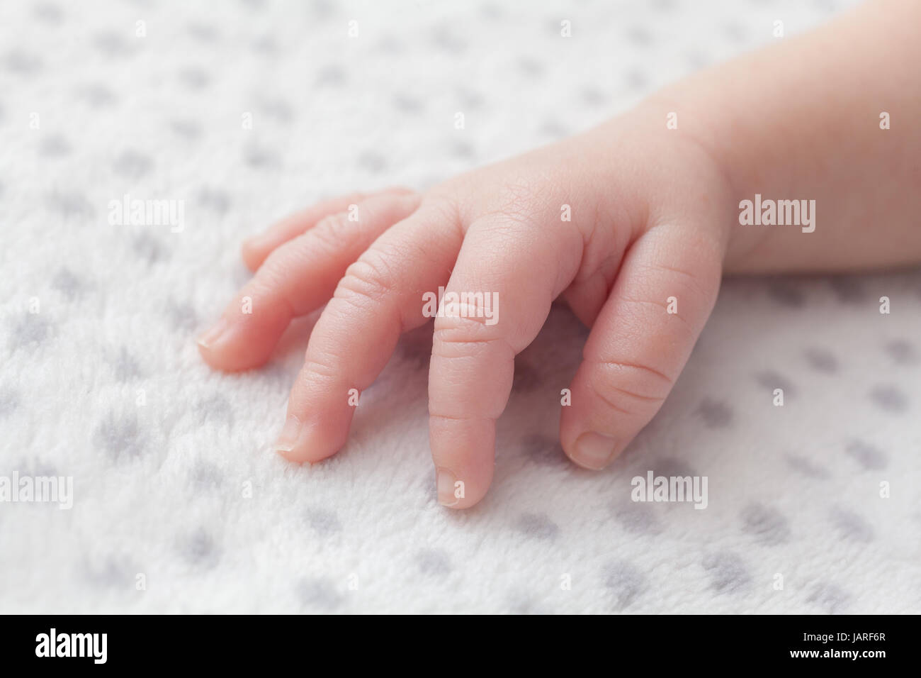 Newborn hand hi-res stock photography and images - Alamy