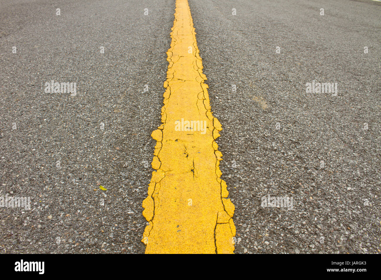 Asphalt dark texture with yellow lines Stock Photo - Alamy