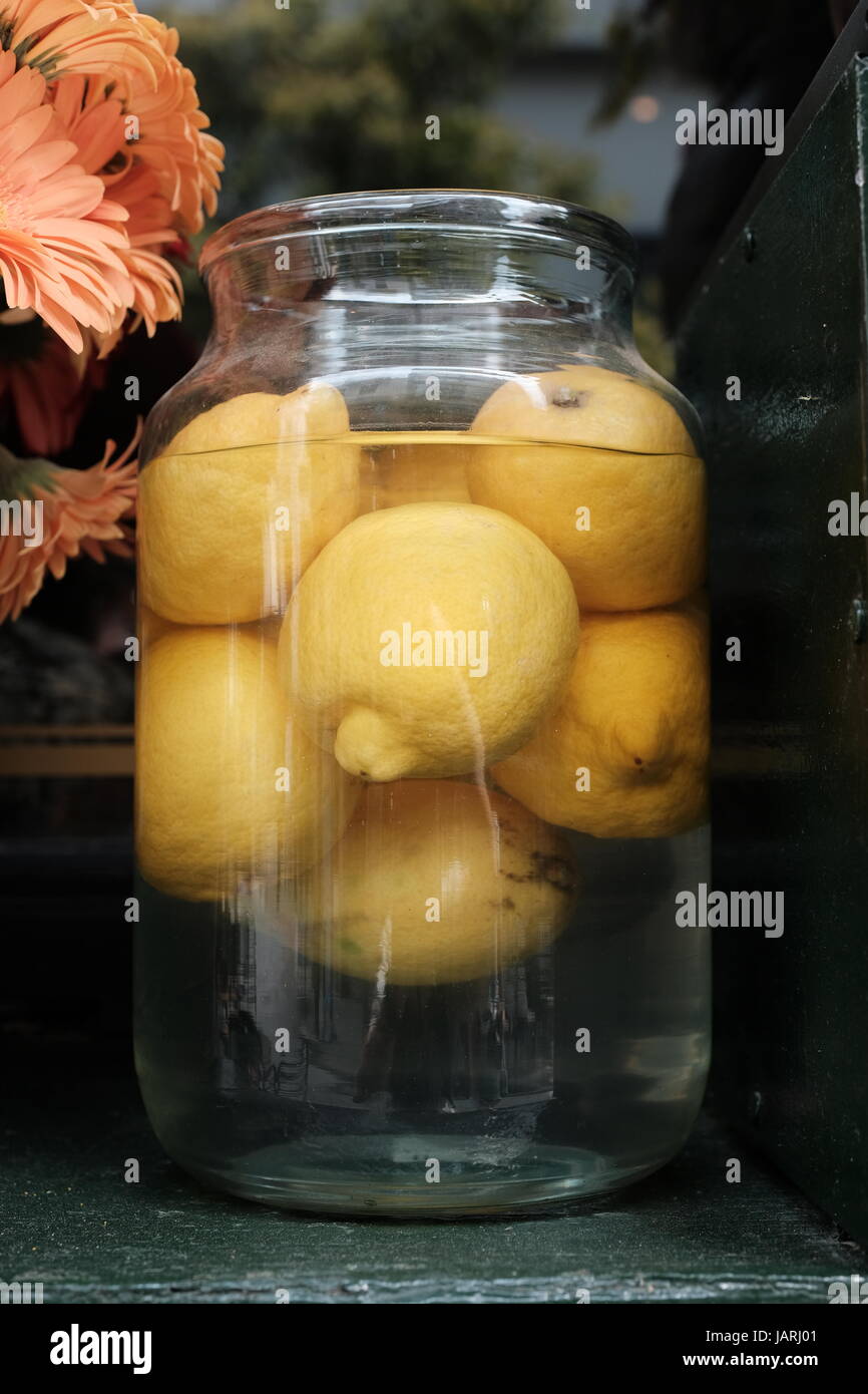 Lemons in a jar full of water Stock Photo - Alamy