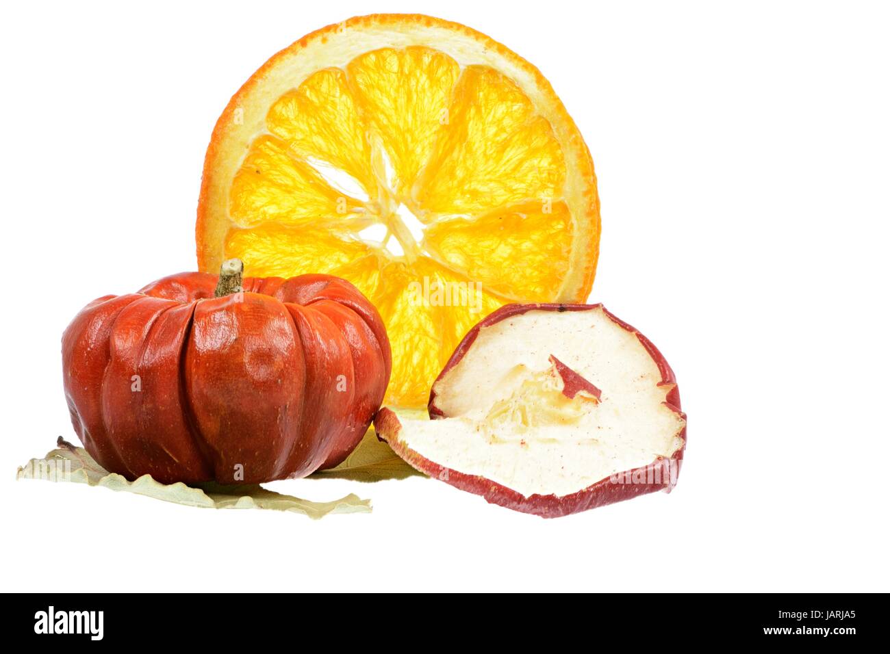 Dry fruits as decoration - paprika, orange and apple Stock Photo - Alamy