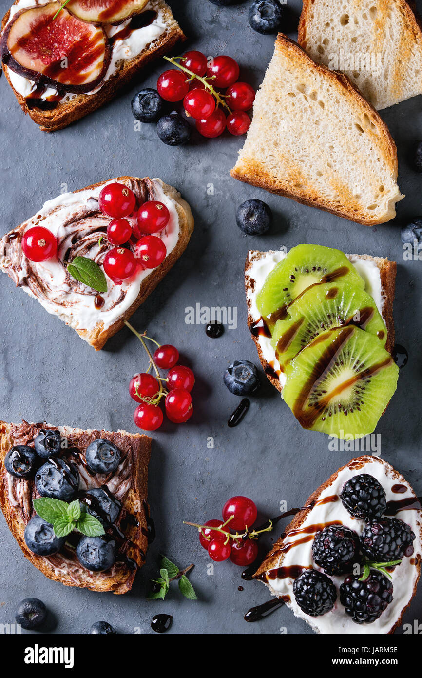 Variety of dessert sandwiches with berries and cream cheese and ...