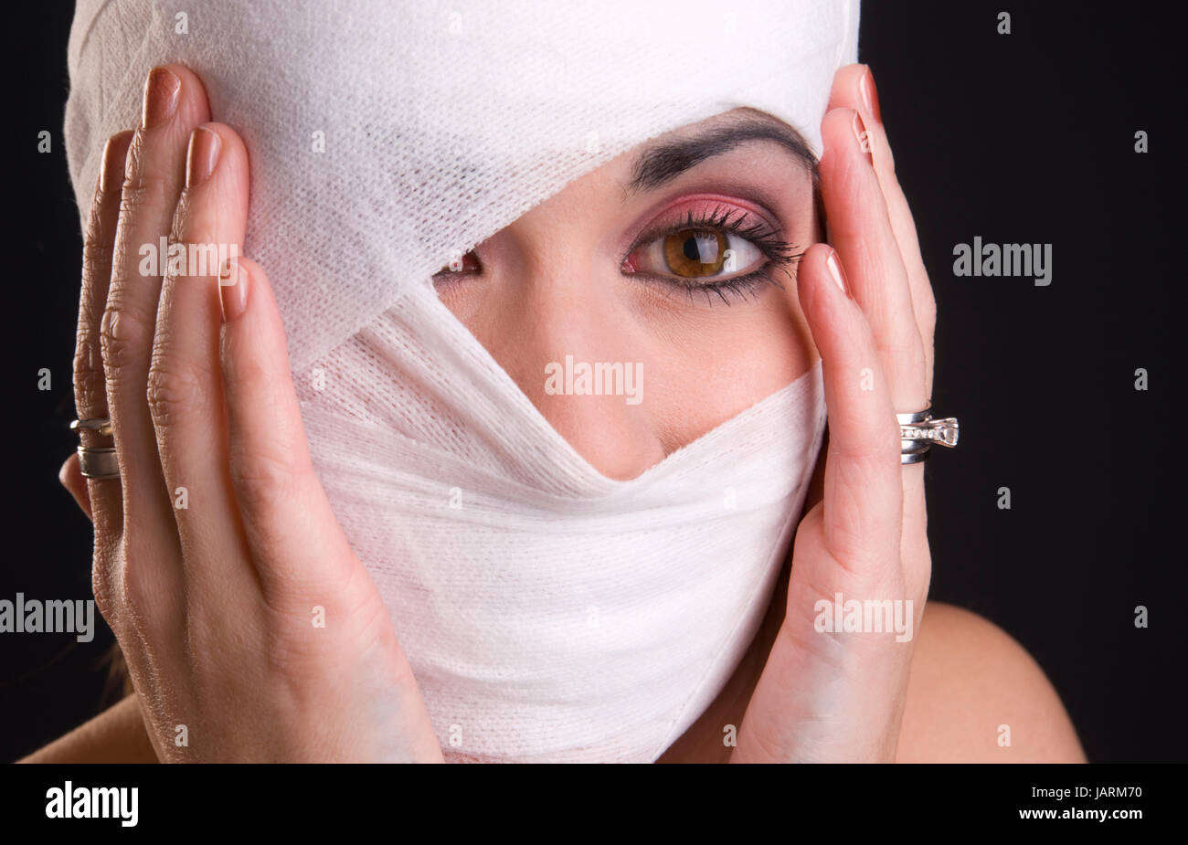 Woman head wrapped in bandage hi-res stock photography and images - Alamy