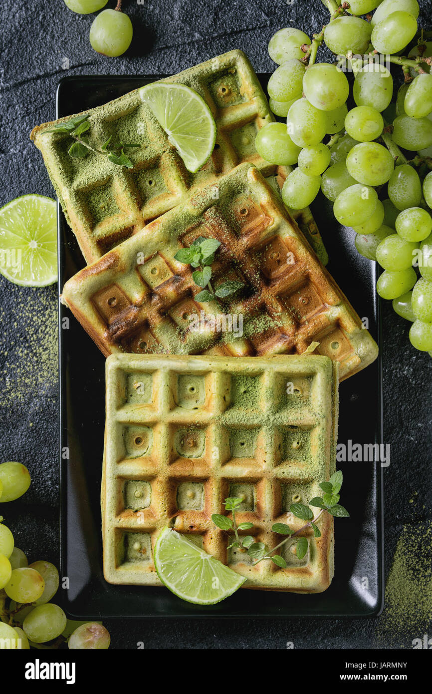 Green waffles with grapes Stock Photo - Alamy