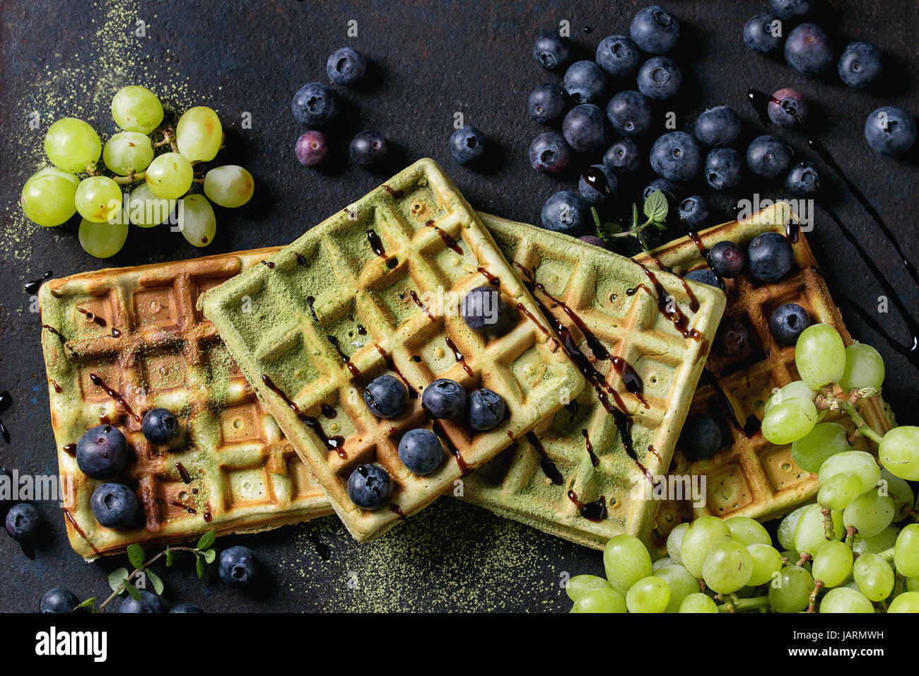 Green waffles with grapes Stock Photo - Alamy