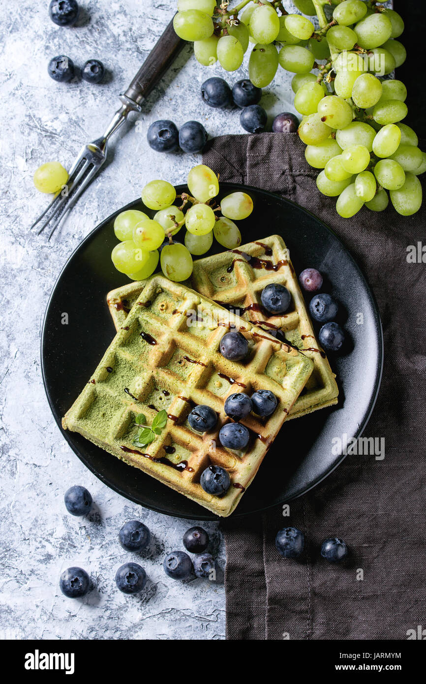 Green waffles with grapes Stock Photo - Alamy