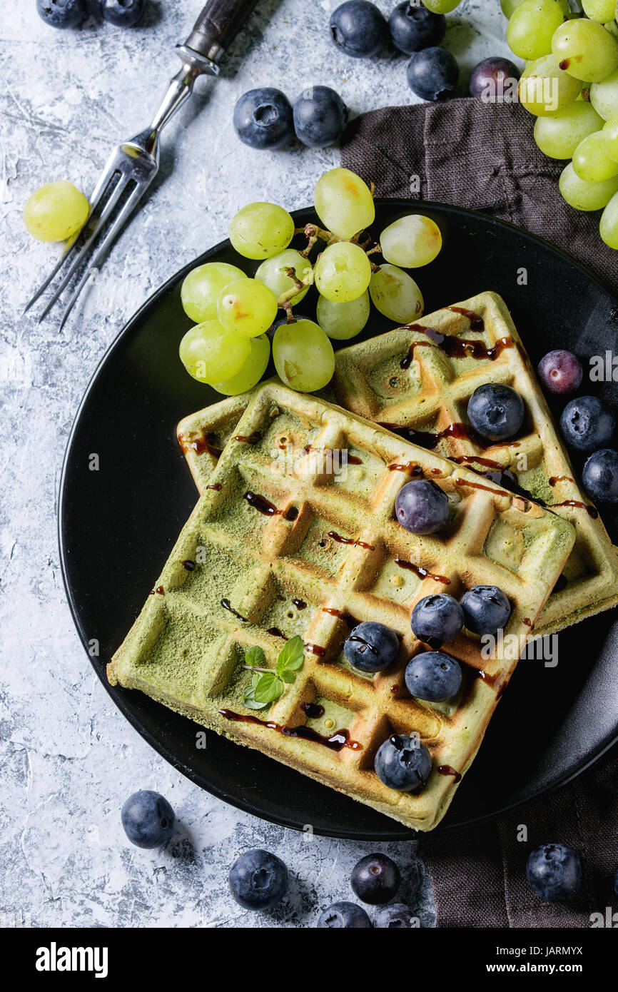 Green waffles with grapes Stock Photo - Alamy