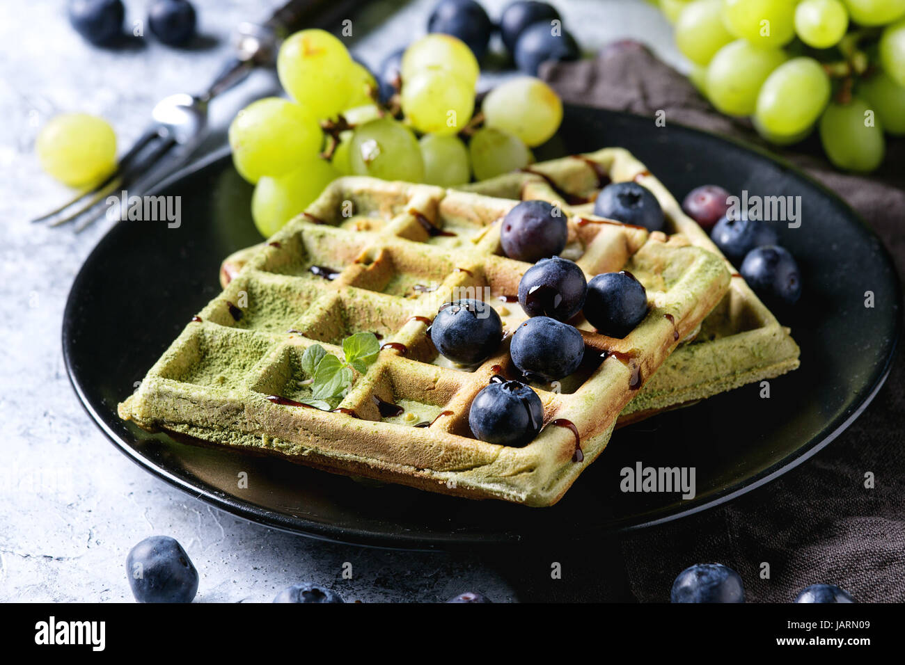 Green waffles with grapes Stock Photo - Alamy