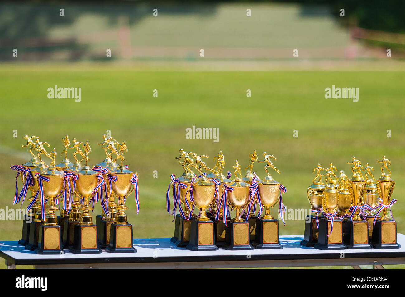 track and field trophies set up outdoor on table waiting for winners ...