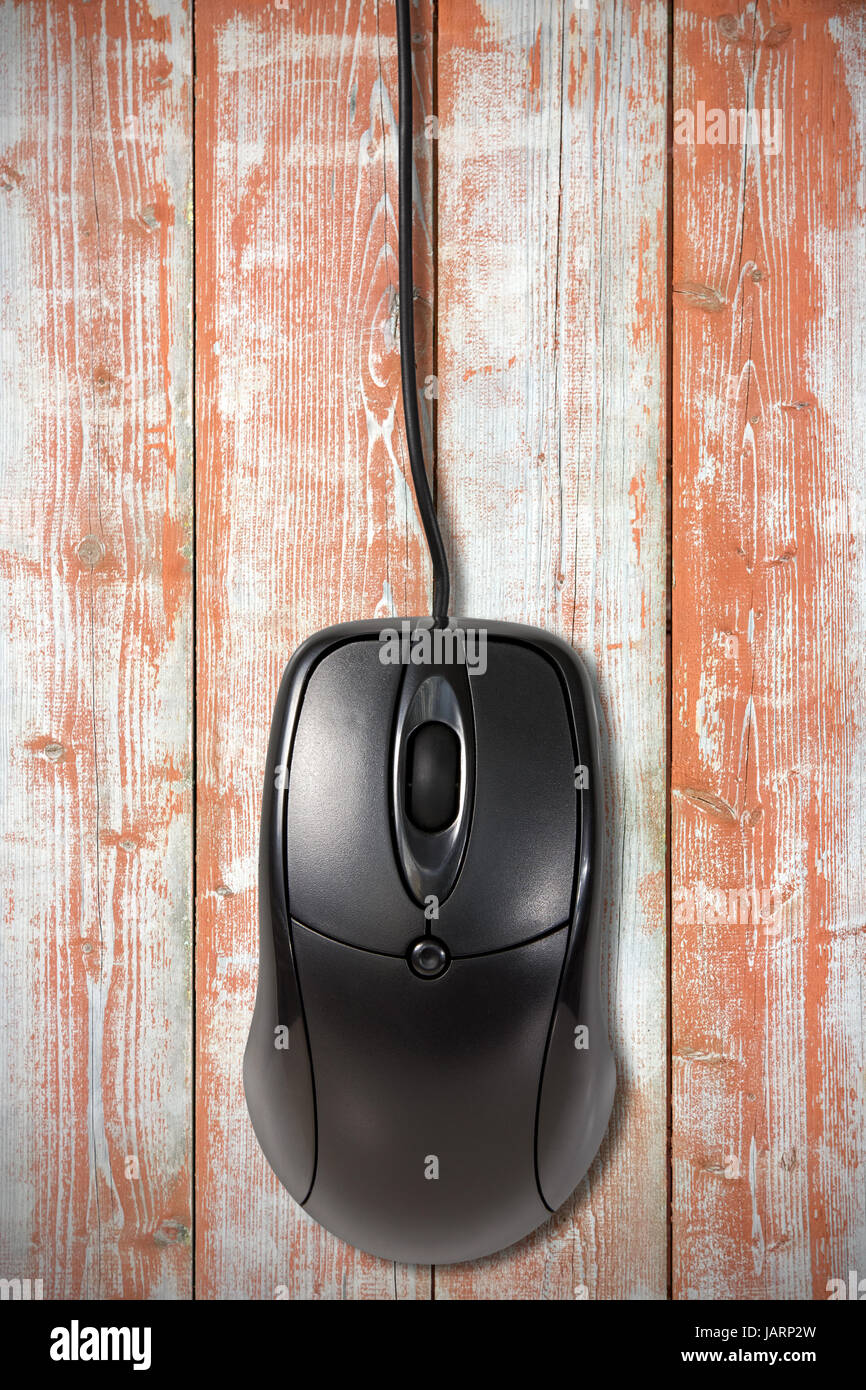 Black computer mouse on the old wooden planks background Stock Photo ...
