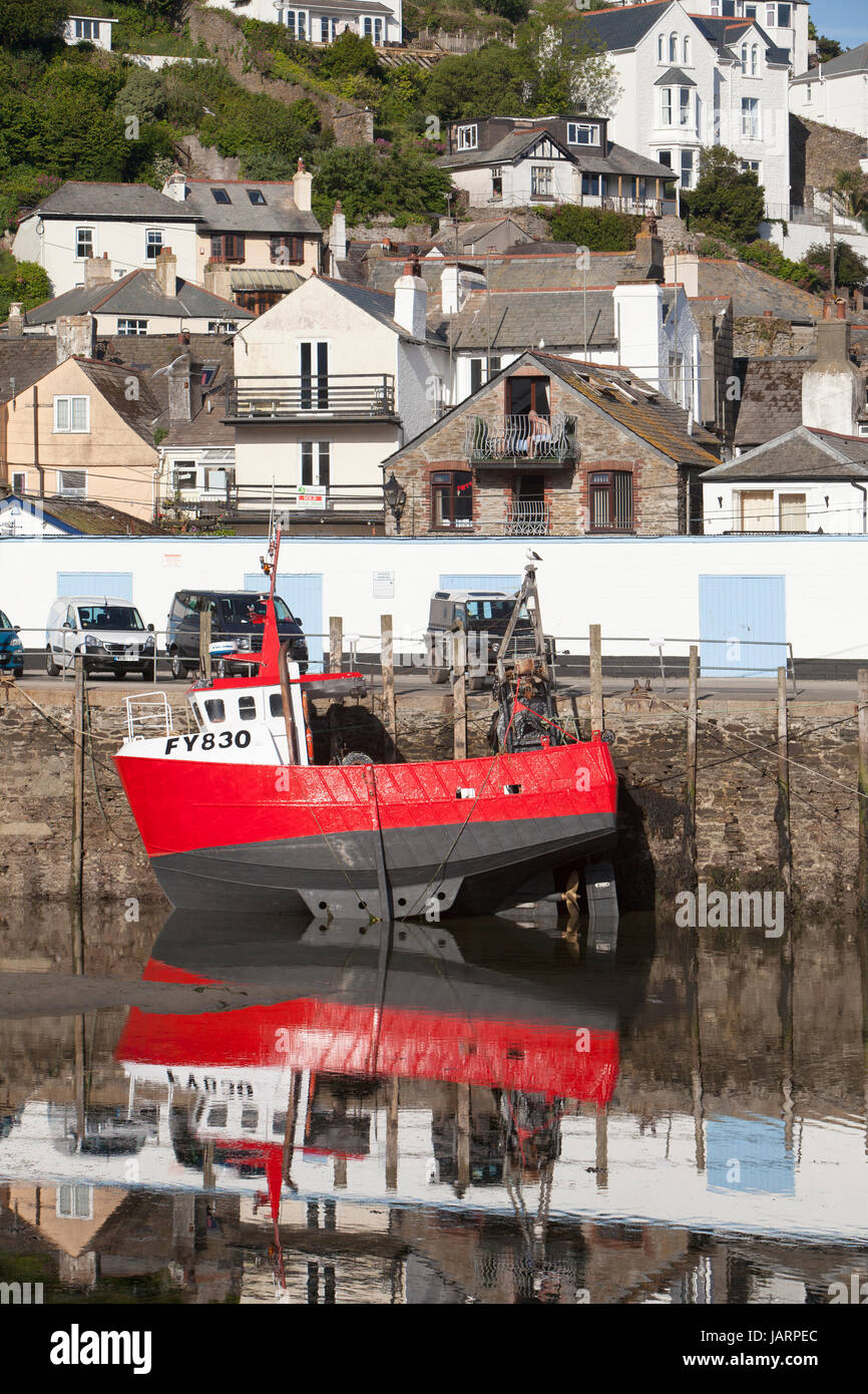 Fishing boats moored alongside the quay at the seaside town of Looe ...