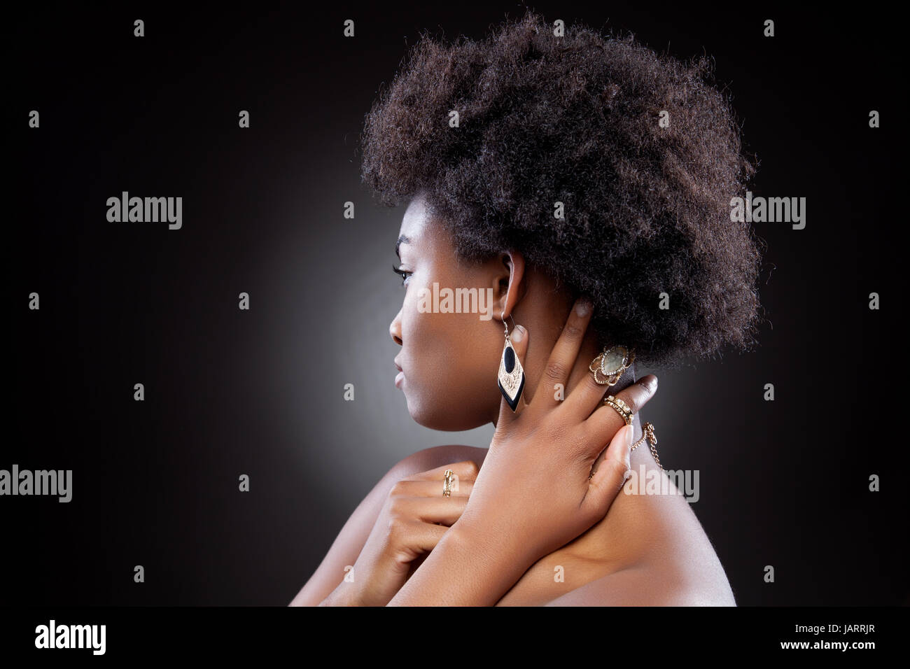 Profile view of a black beauty with afro hairstyle Stock Photo - Alamy