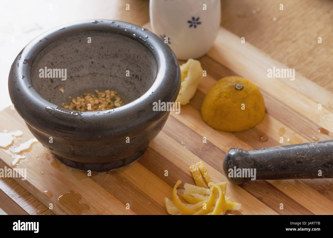 Mortar, pestle, cutting board and lemon in a kitchen Stock Photo - Alamy