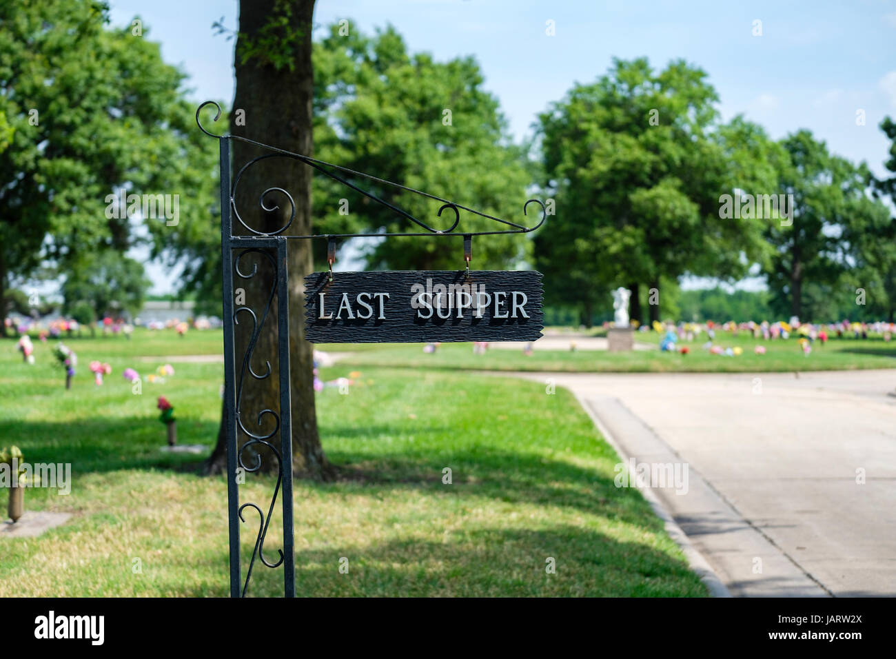 A sign in a cemetary on Memorial Day that says Last Supper, a name for ...