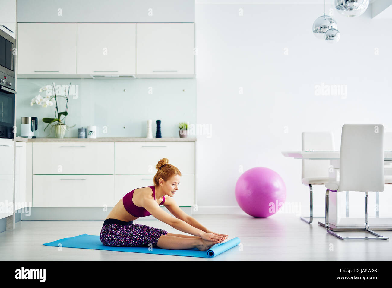 Young Woman Doing Fitness Exercise at Home Stock Photo - Alamy