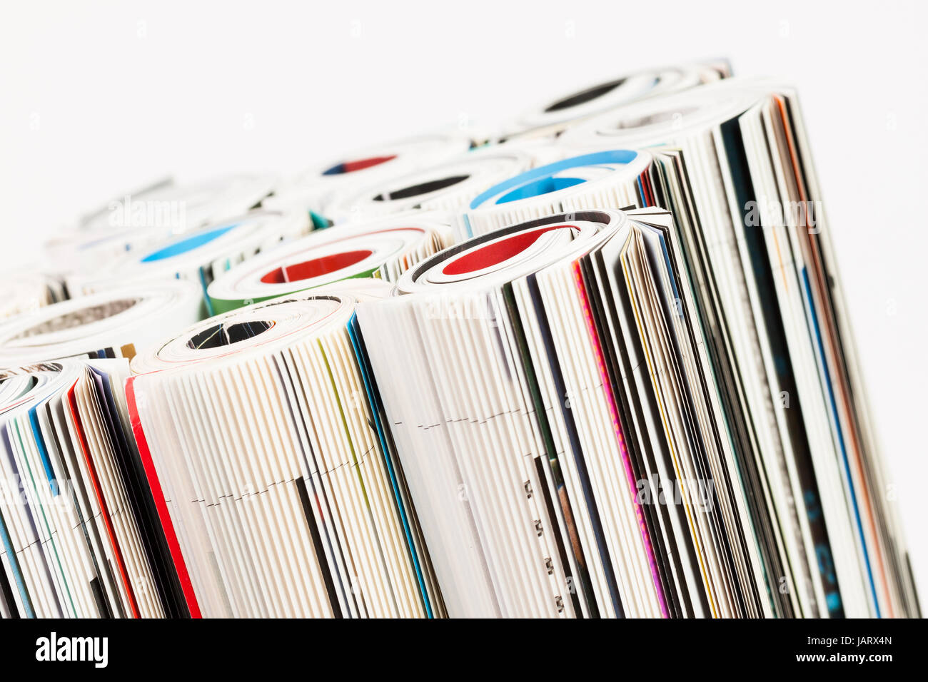Stack of color magazines on white background Stock Photo - Alamy