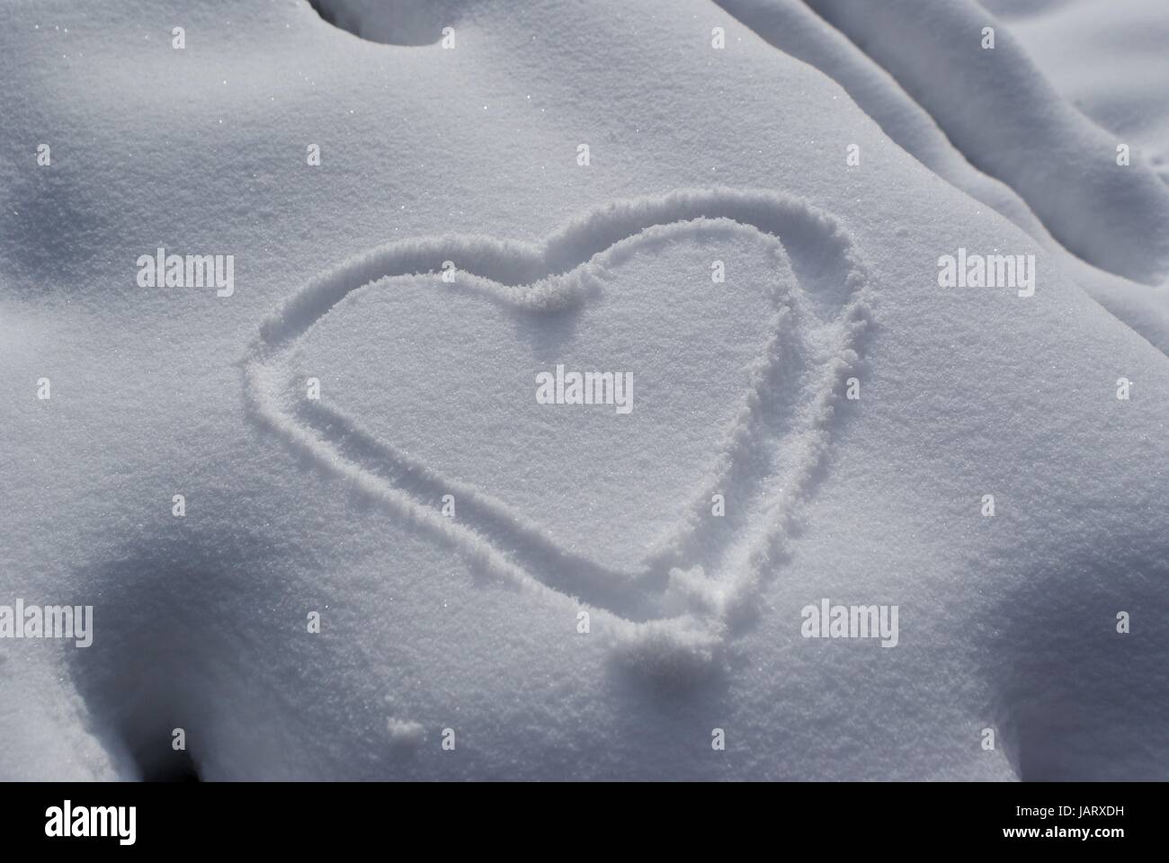 heart in snow Stock Photo - Alamy