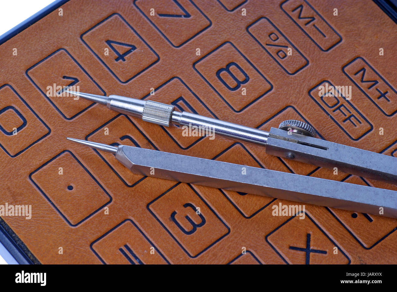 brown calculator and compass on white background Stock Photo - Alamy