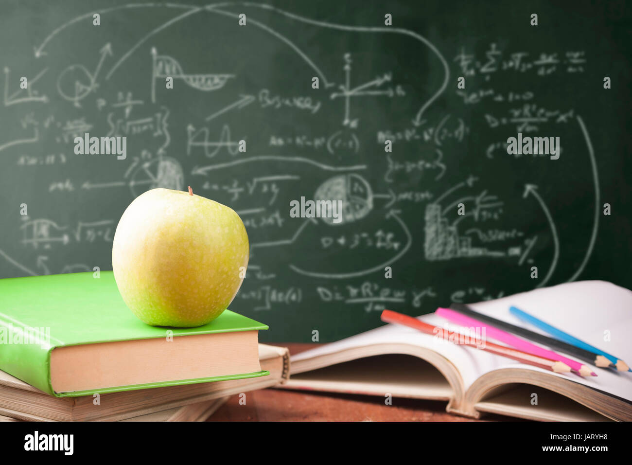 Stack of books in classroom Stock Photo - Alamy