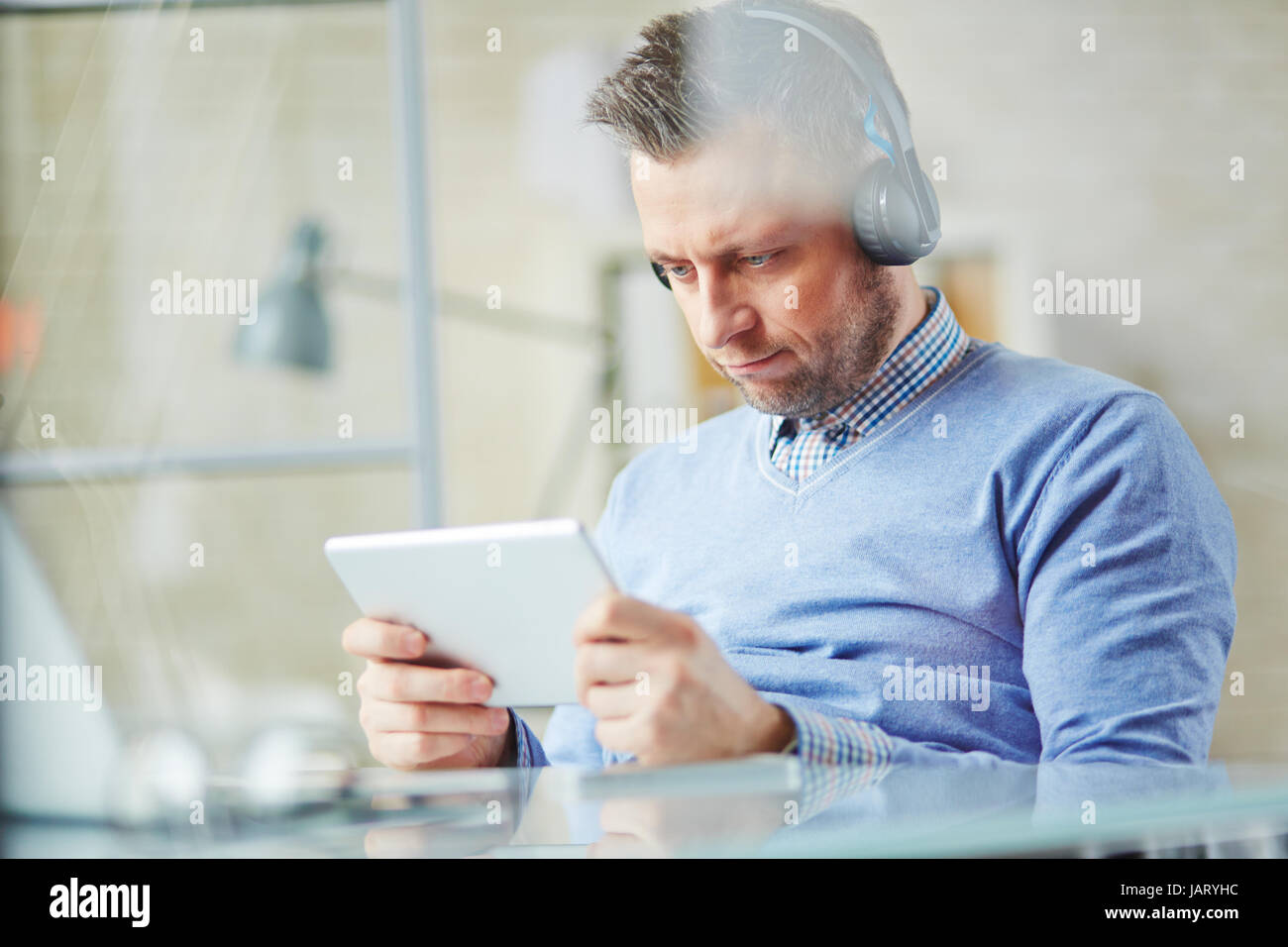 Watching movie in office Stock Photo - Alamy