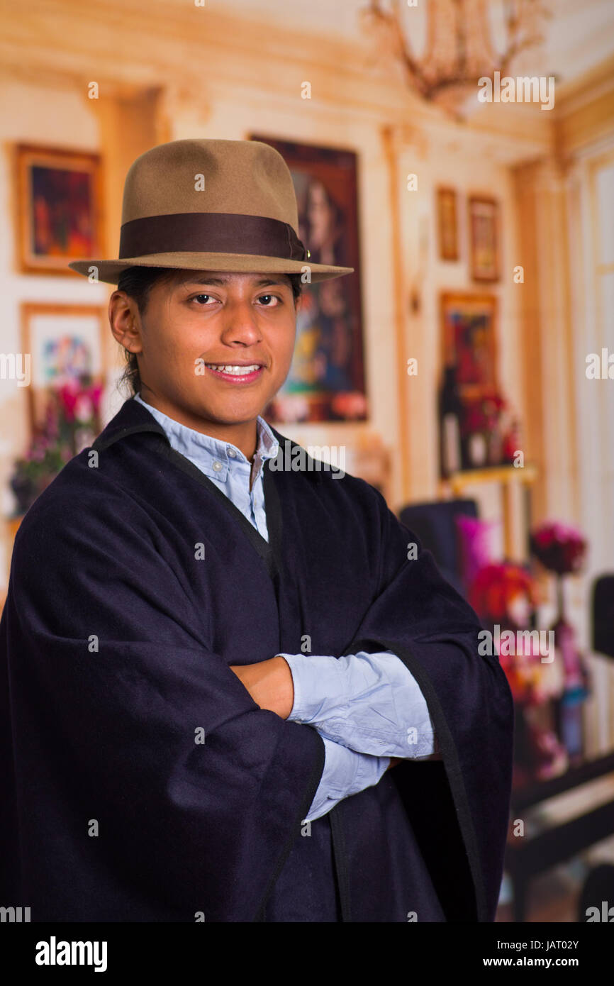 Close up portrait of smiling young indigenous man wearing traditional ...