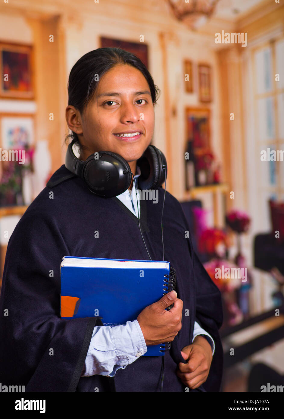 Close up portrait of handsome latin indigenous young man listening ...