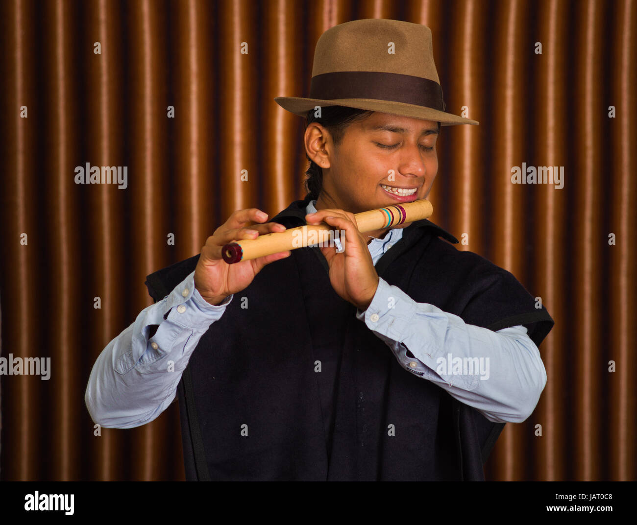 Close up portrait of handsome young indigenous man from Otavalo ...