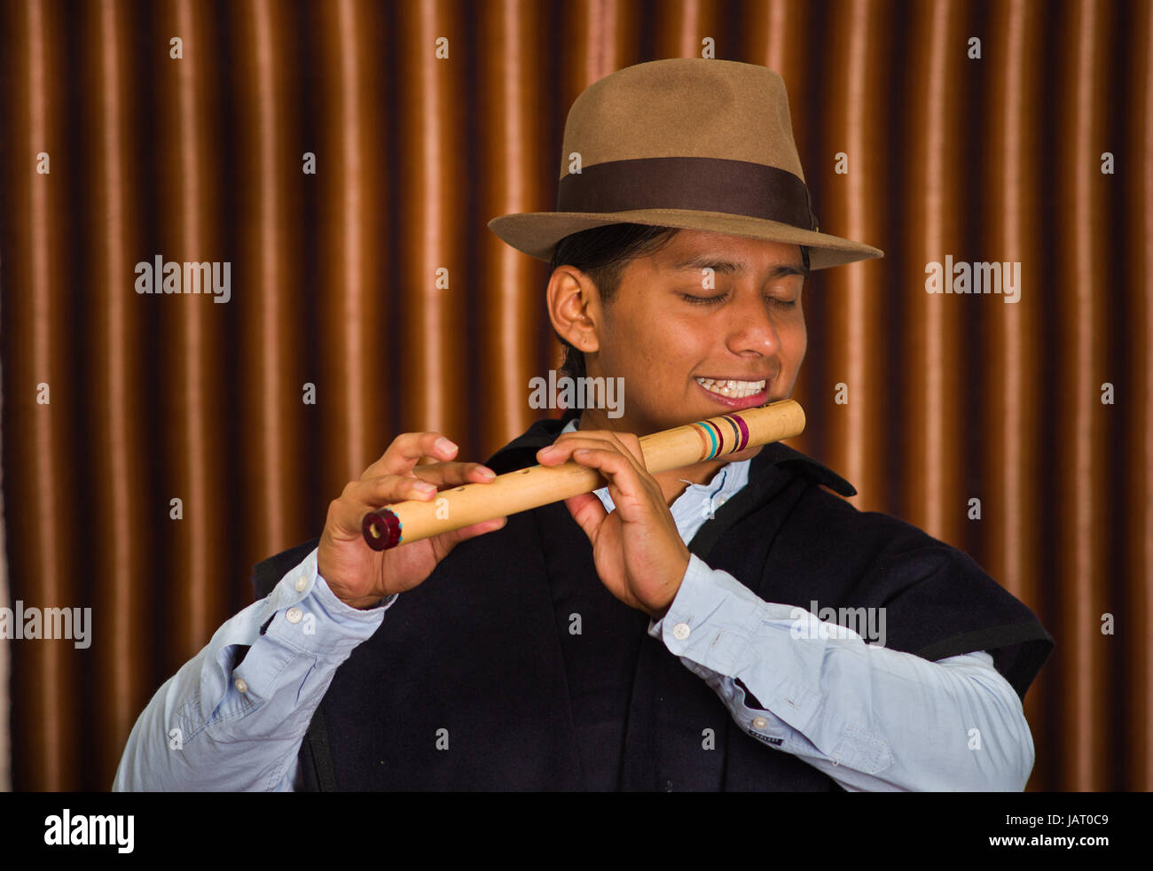 Close up portrait of handsome young indigenous man from Otavalo ...