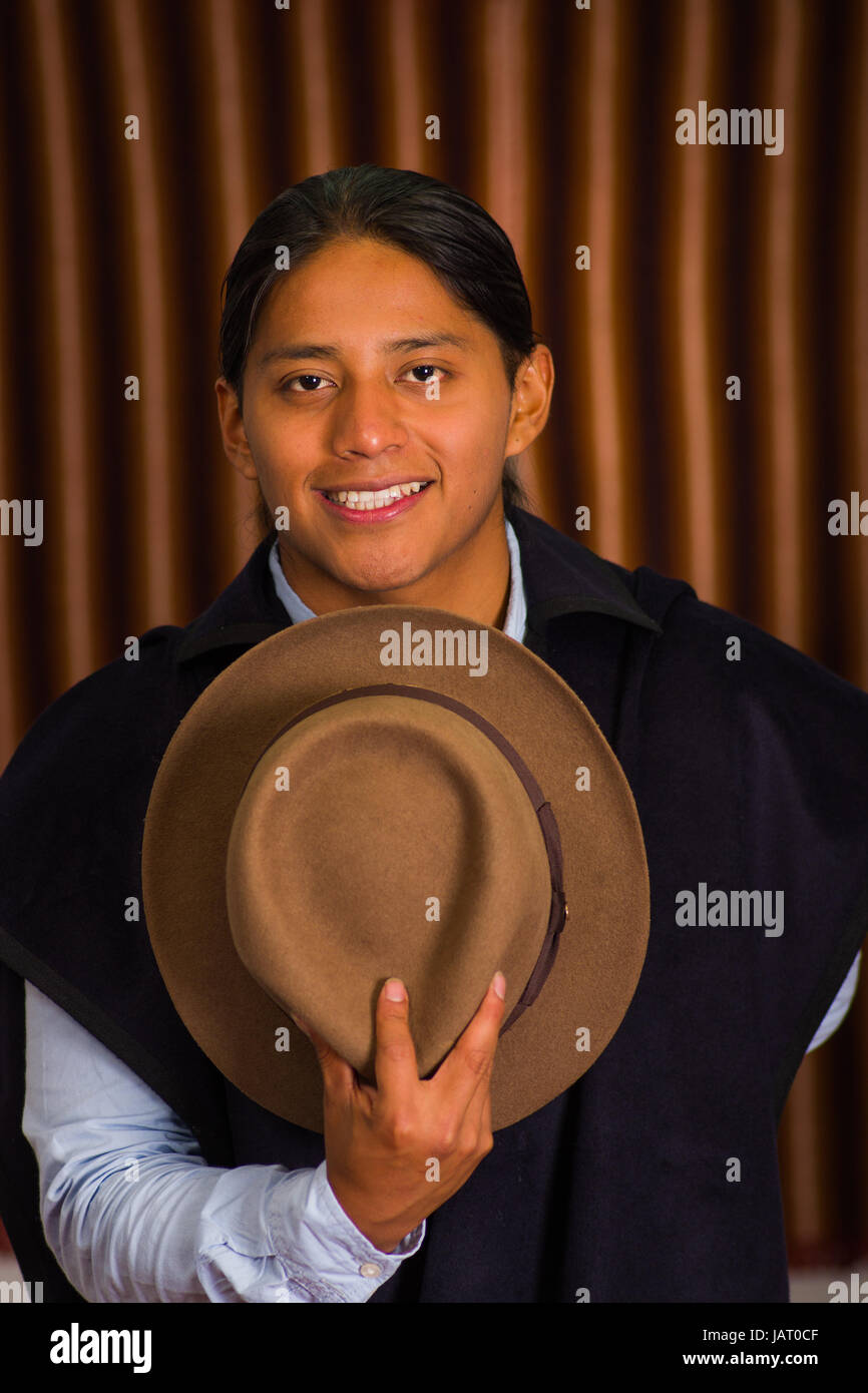 Close up portrait of friendly young indigenous latin american man ...